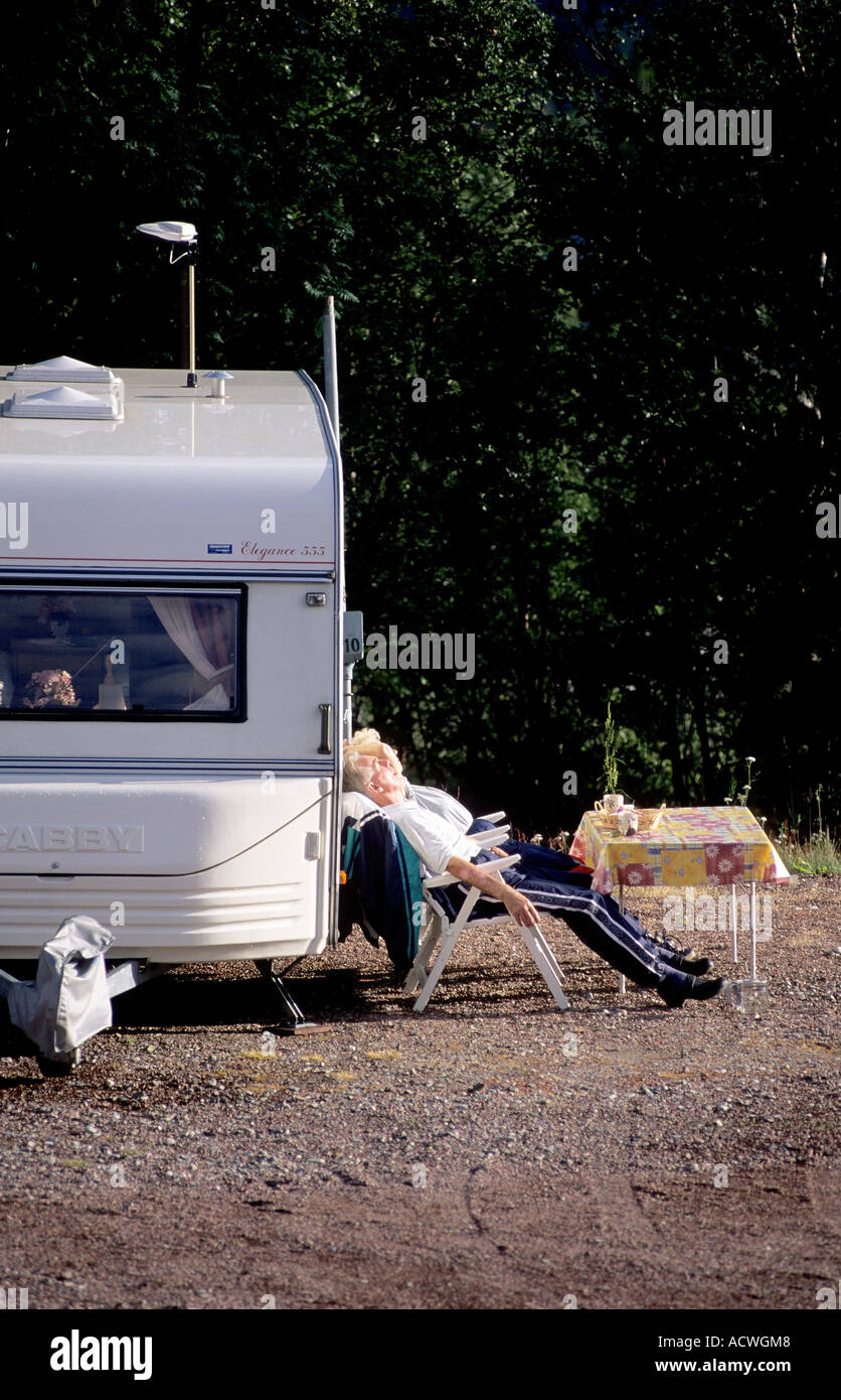 Resting outside camping caravan Stock Photo - Alamy