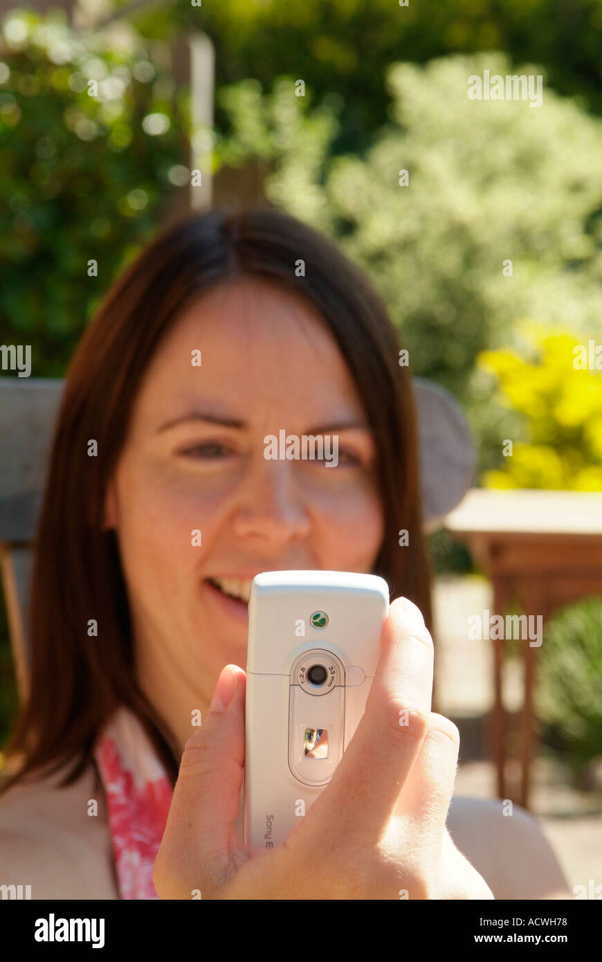 woman photographs with photo mobile phone Stock Photo - Alamy