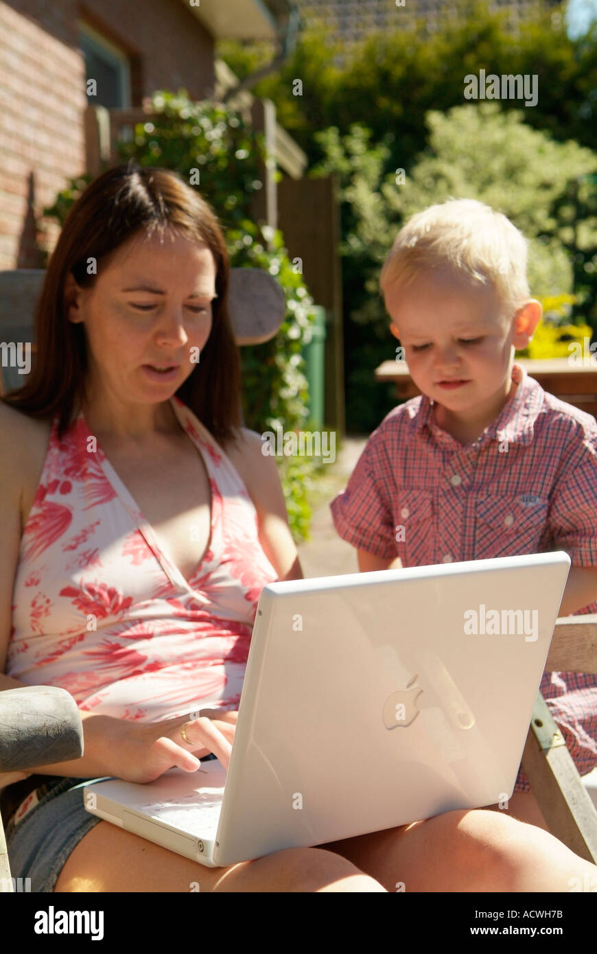 mother and child with ibook on the terrace Stock Photo - Alamy