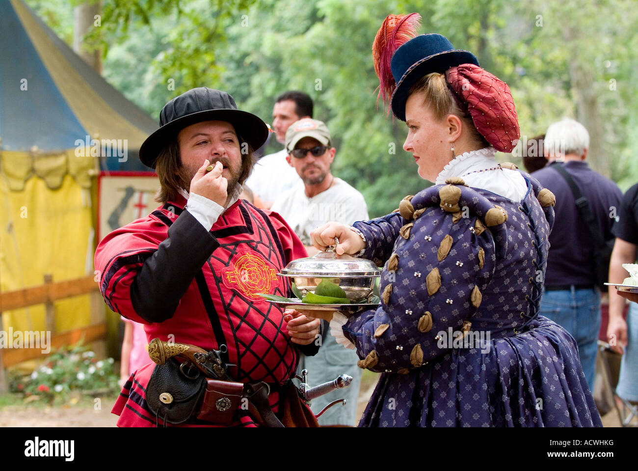 TASTER OF THE ROYAL COURT EATING SMALL PIECE OF THE DISH BEFORE IT IS ...