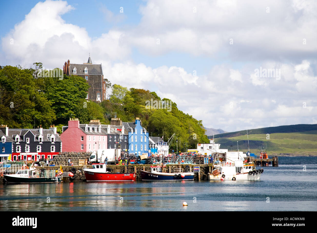 Tobermory town and harbour in late spring early summer sunshine blue ...