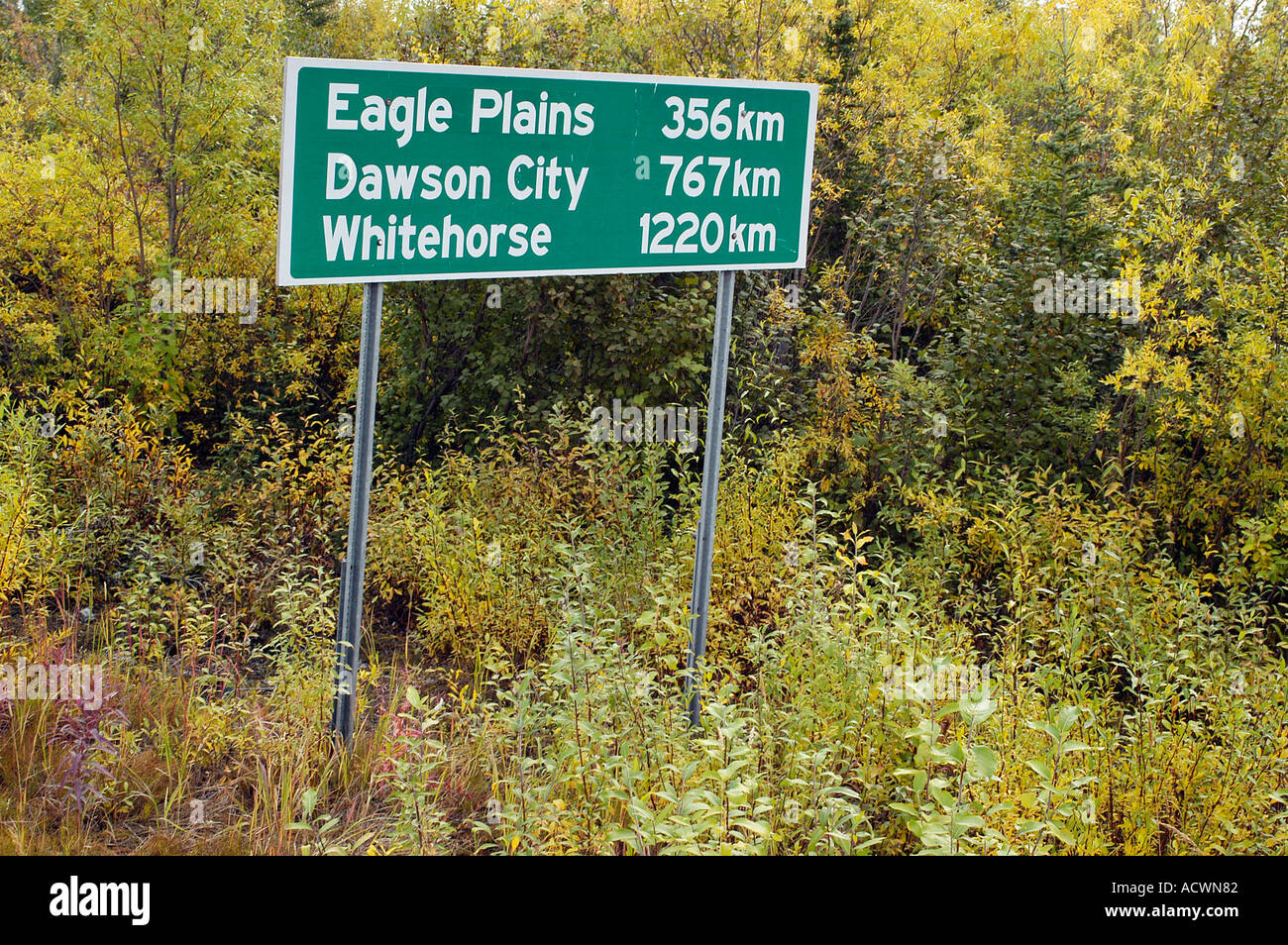 traffic sign with distance information along Dempster Highway Stock ...