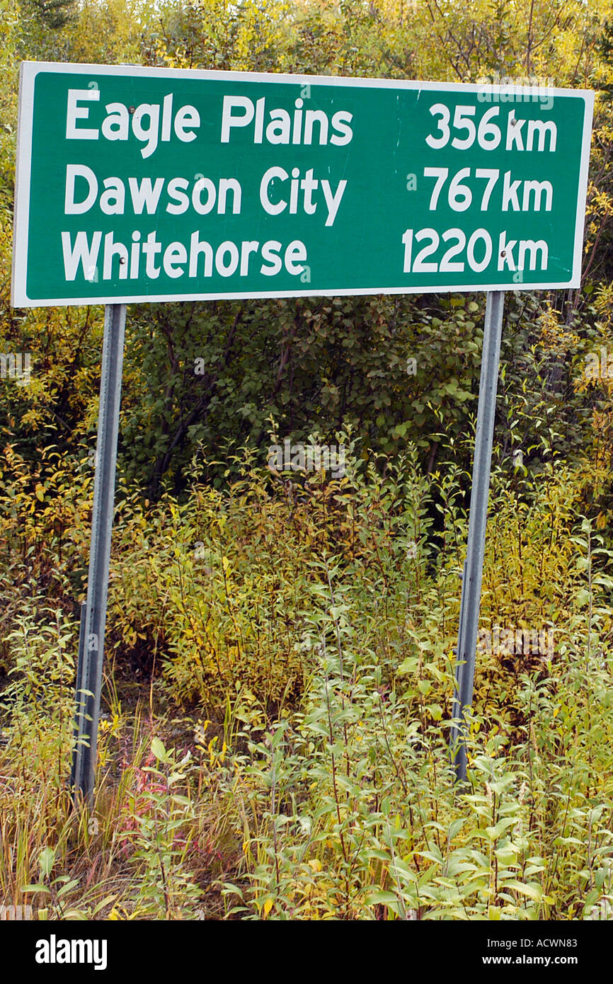 traffic sign with distance information along Dempster Highway Stock ...