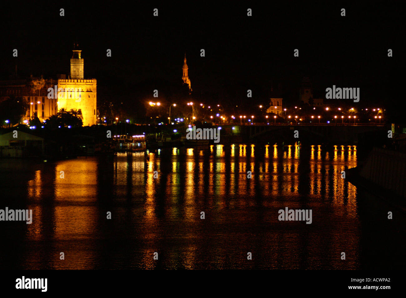 Floodlit Torre del Oro octagonal tower by river Guadalquivir Seville ...