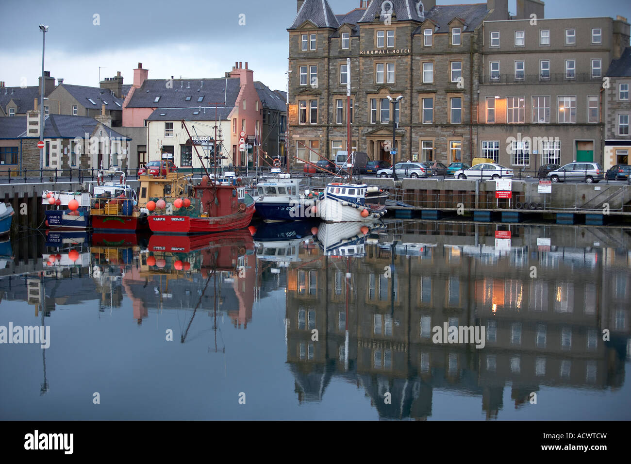 Kirkwall Harbour Orkney Scotland Fishing boats and buildings reflected ...