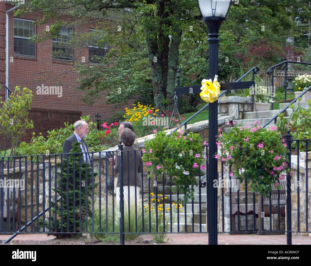 Adults talking on sidewalk Stock Photo - Alamy