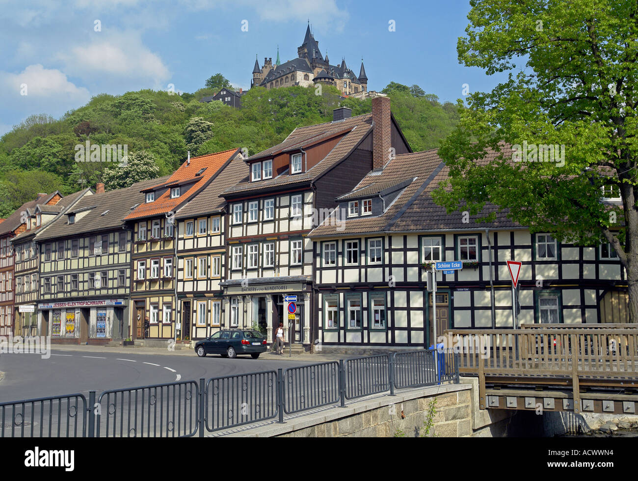 Schloss Wernigerode dominates the skyline above old houses in ...