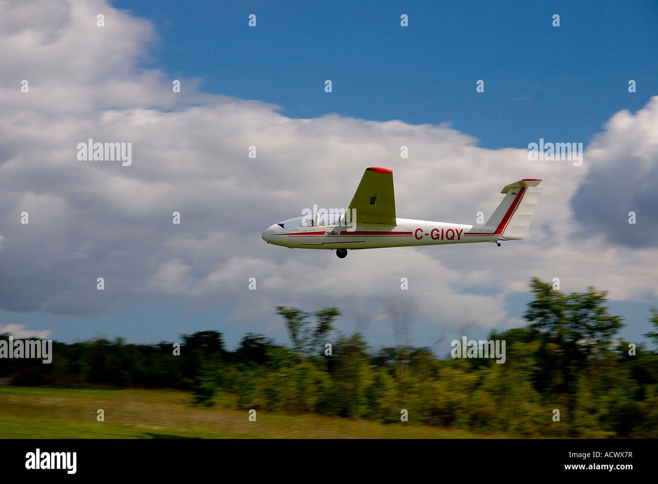 Glider in flight during landing Stock Photo - Alamy