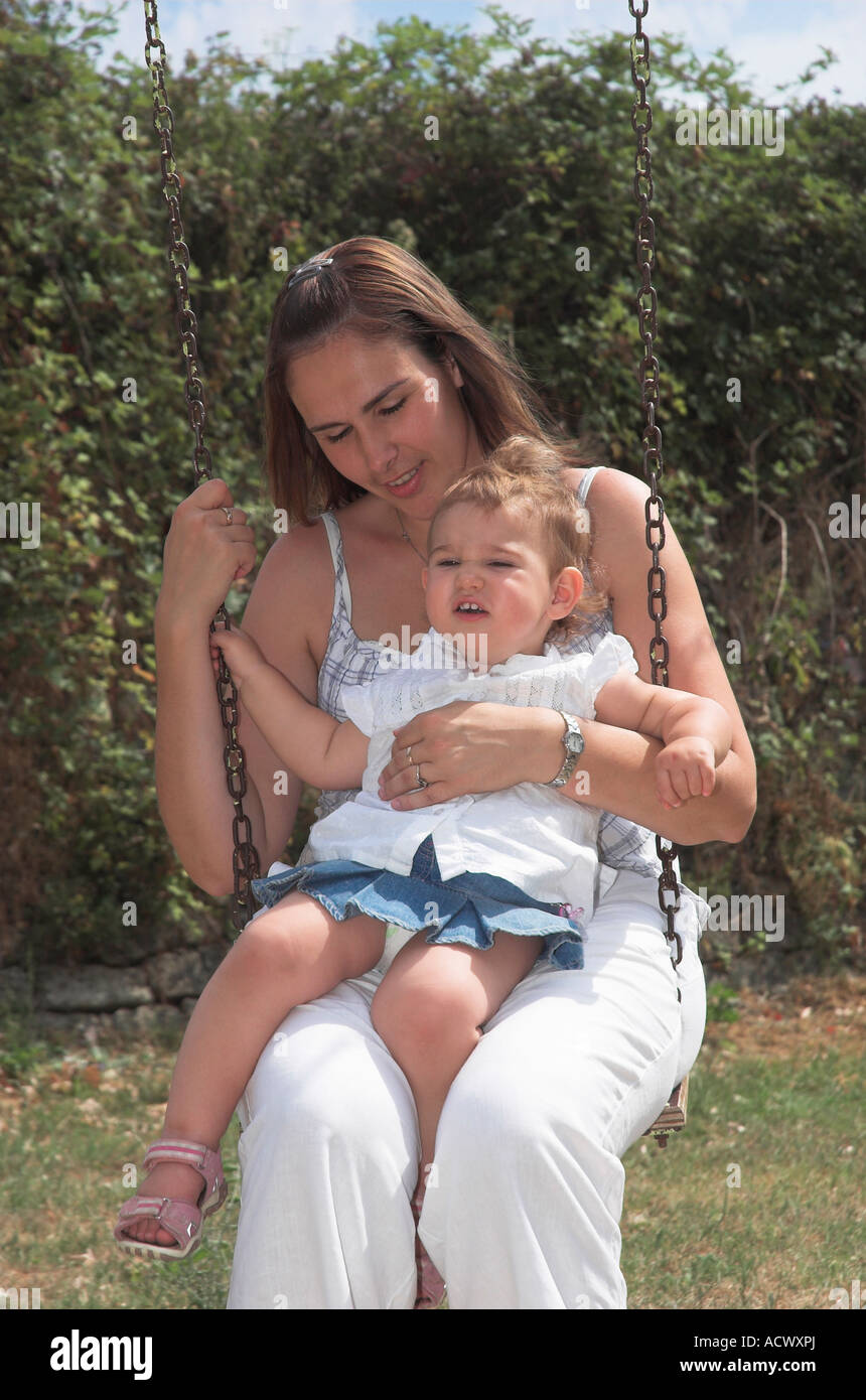 Mom daughter on swing hi-res stock photography and images - Alamy