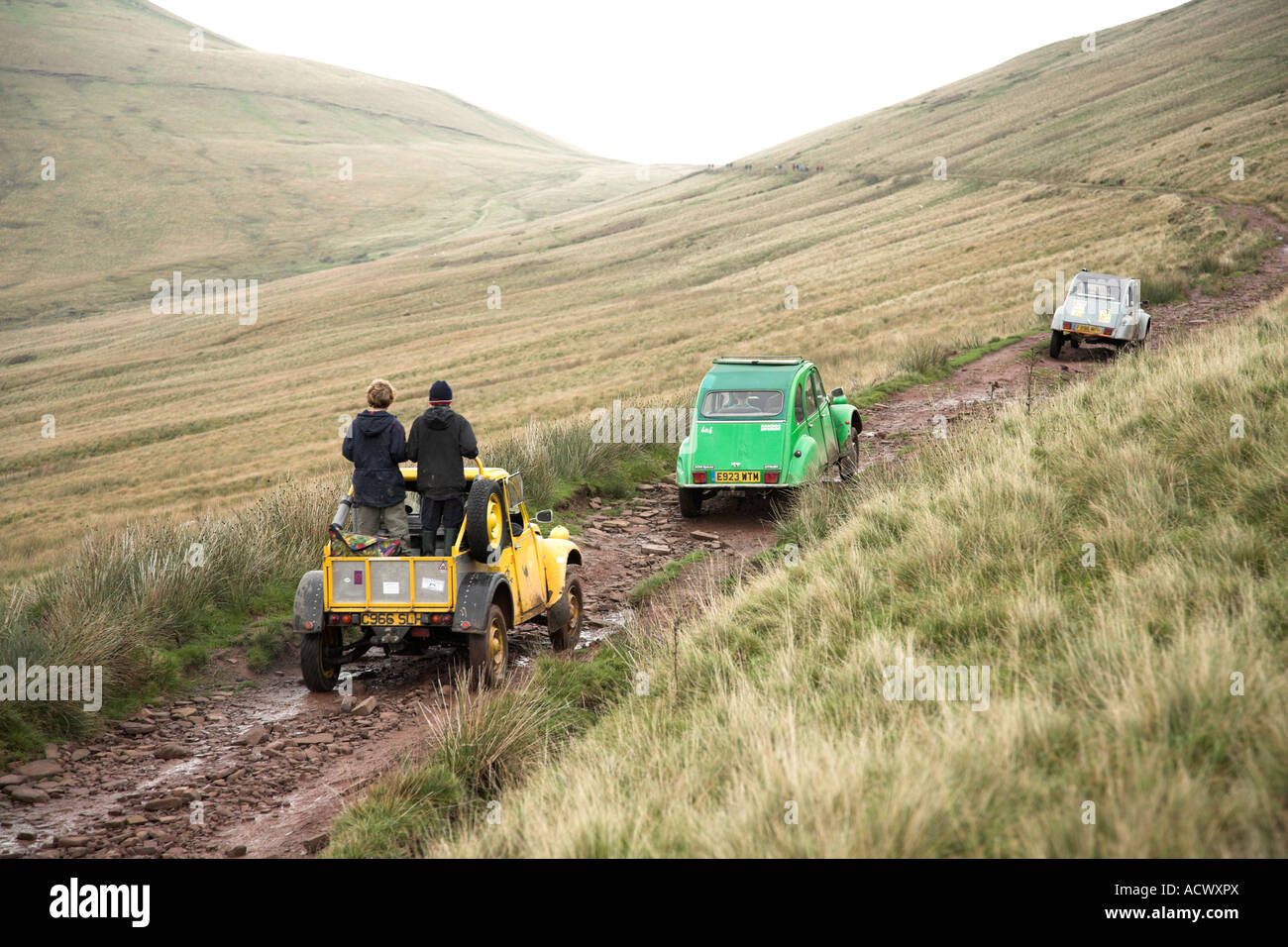 Citroën 2CV rally cars on muddy track near Pen Y Fan Brecon Beacons ...