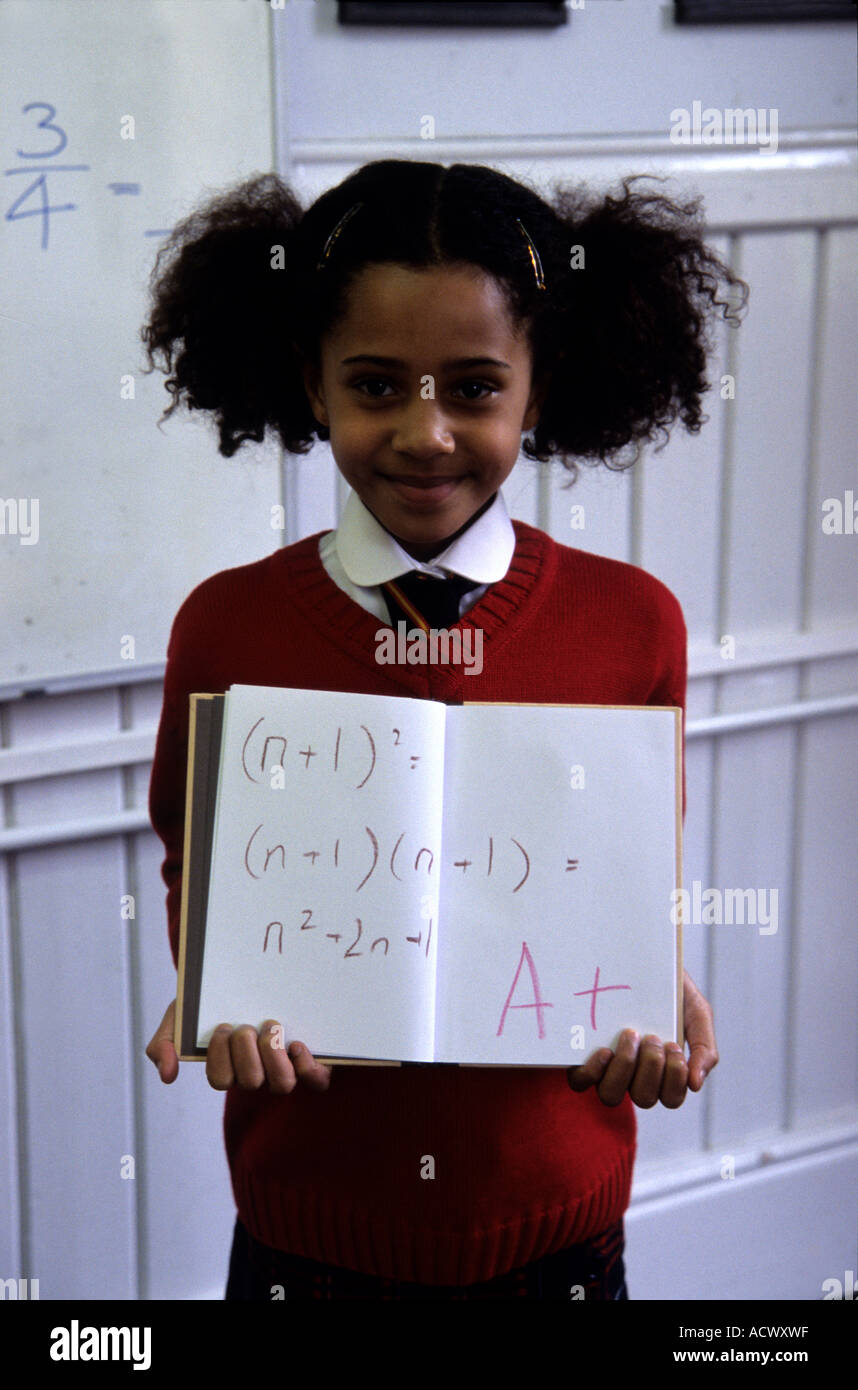Swotty little girl with her maths homework Stock Photo - Alamy