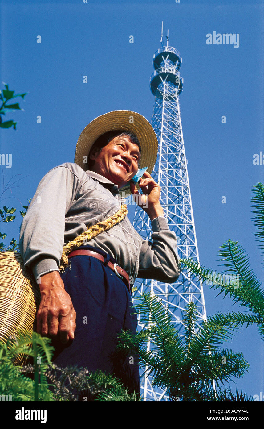 a chinese man telephoning in a field in Hunan China Stock Photo - Alamy
