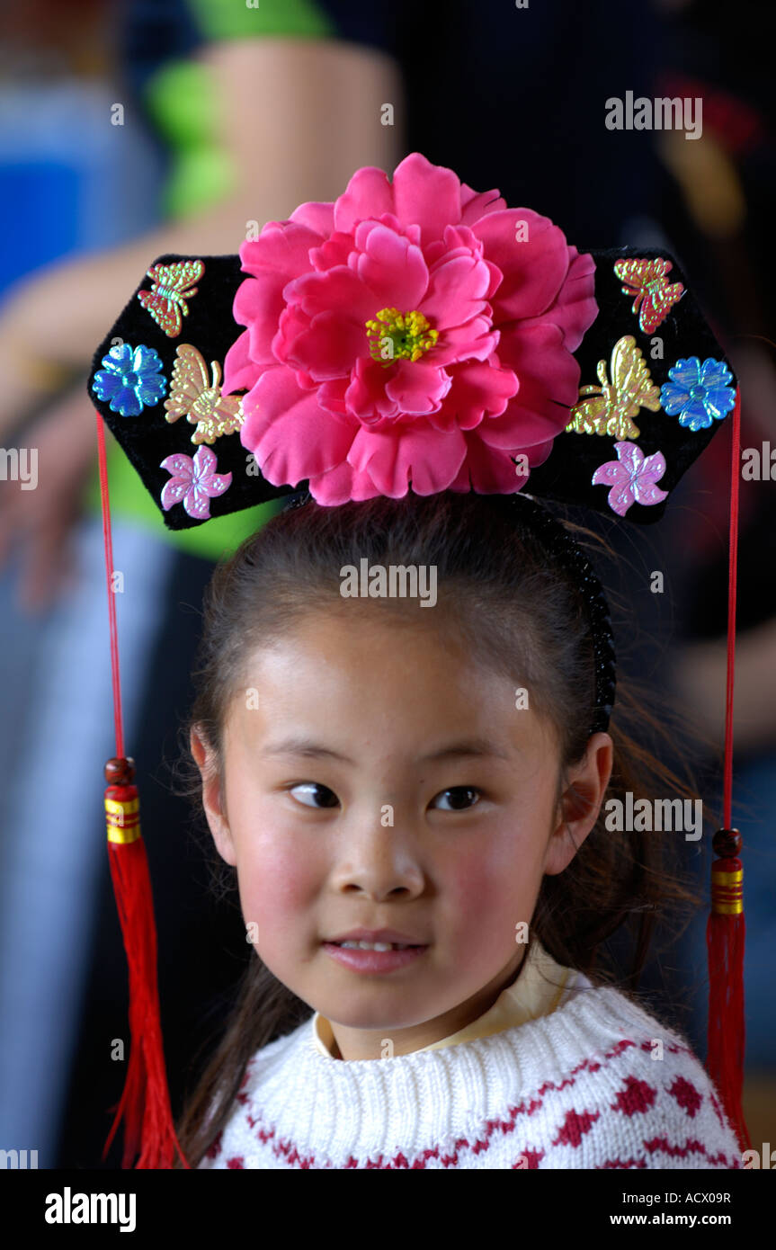 A young girl wearing a traditional Chinese headdress in the Forbidden ...