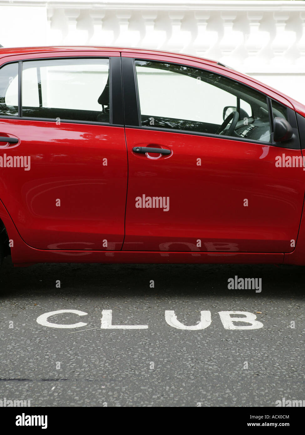 A red club car parked in a London Street Stock Photo - Alamy