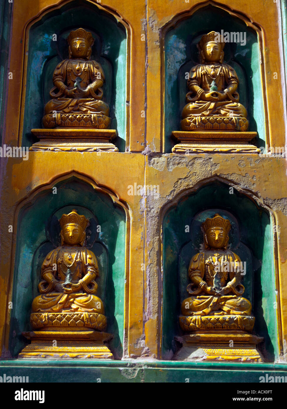Buddha figures in small niches on Sumeru Temples walls in the Summer ...