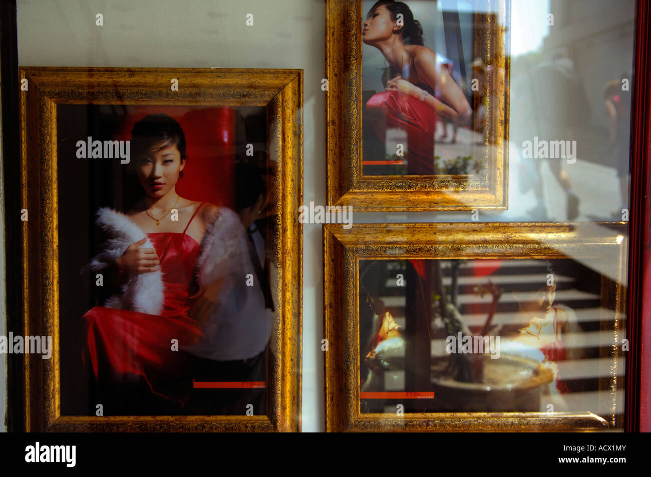 Studies of a Chinese model dressed in red in the doorway of a Xian ...