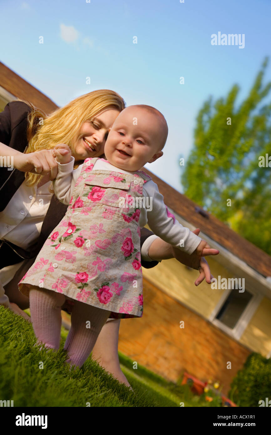 Mother baby outside house hi-res stock photography and images - Alamy