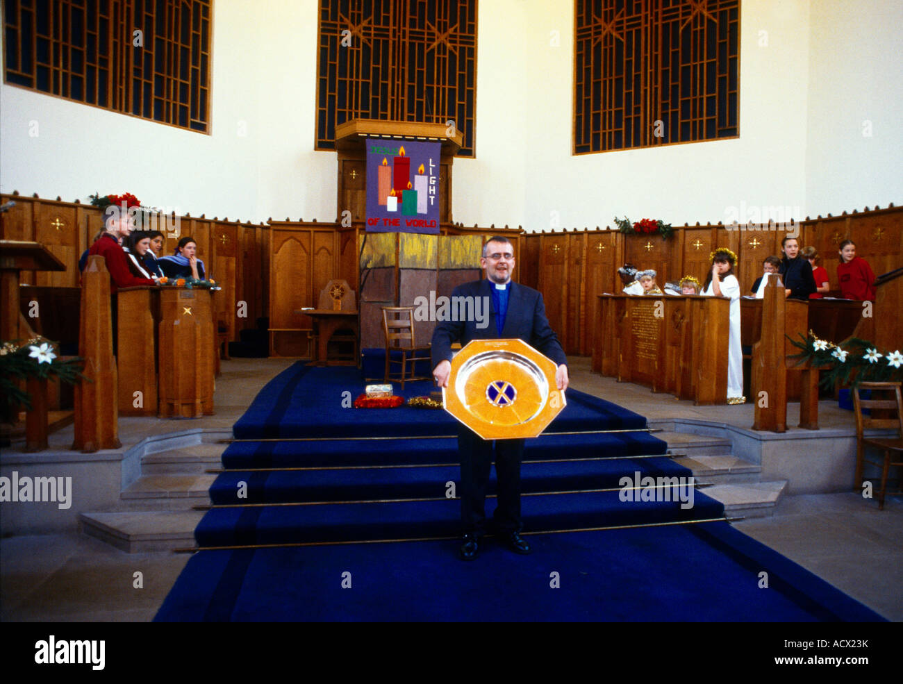 Family with collection plate at church hi-res stock photography and ...