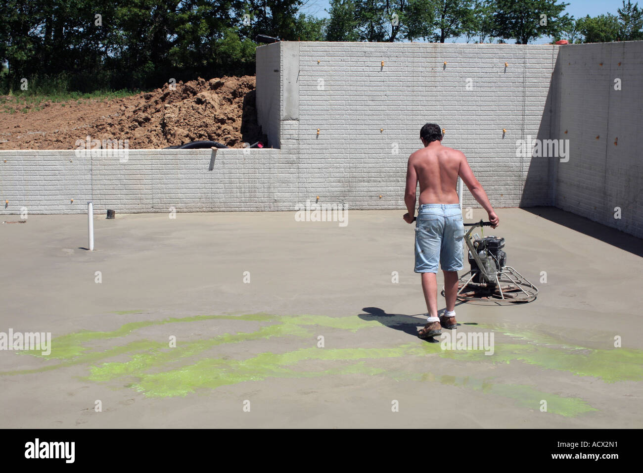 Cement power troweling Stock Photo - Alamy