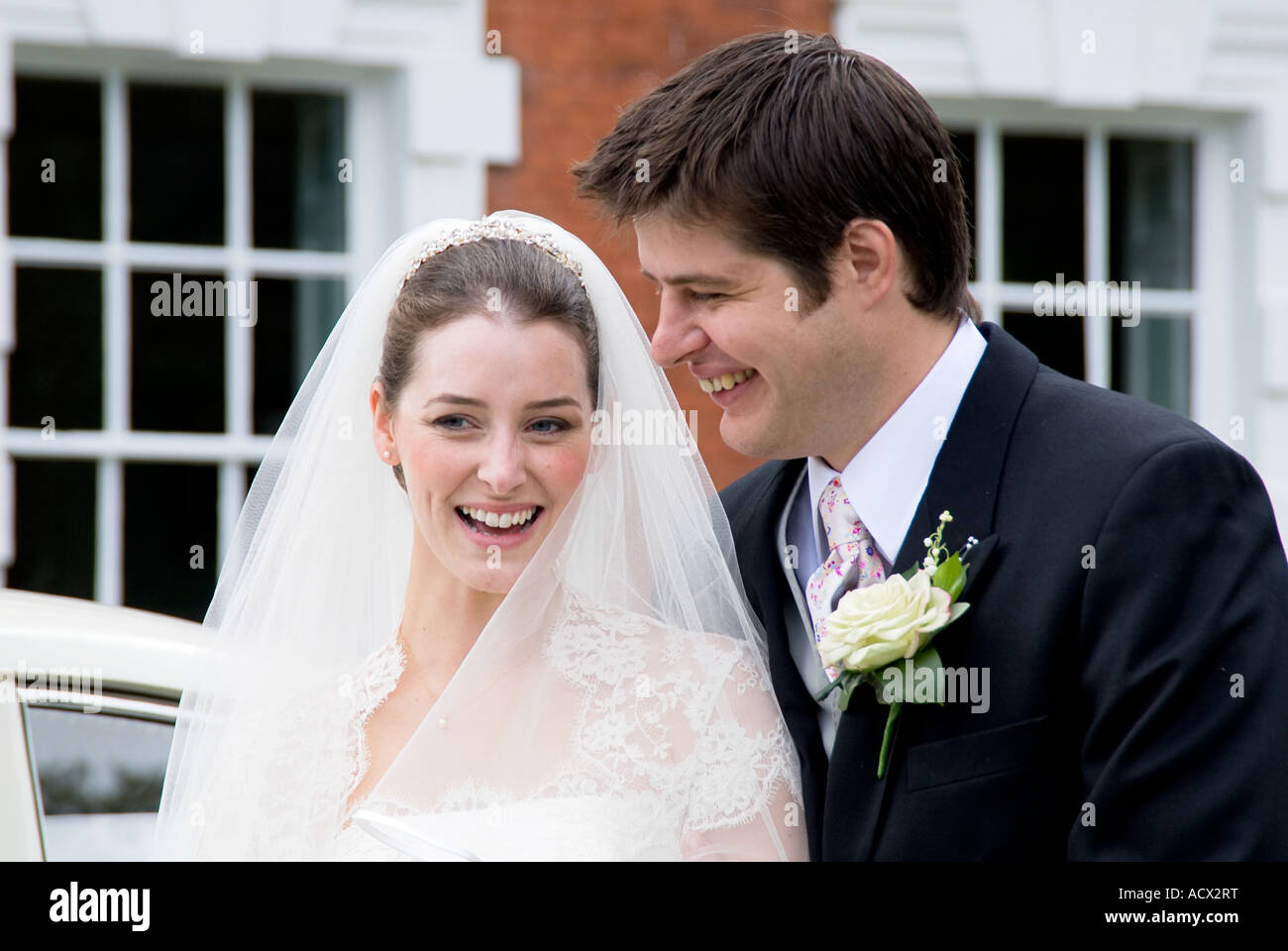 bride and groom laughing Stock Photo - Alamy