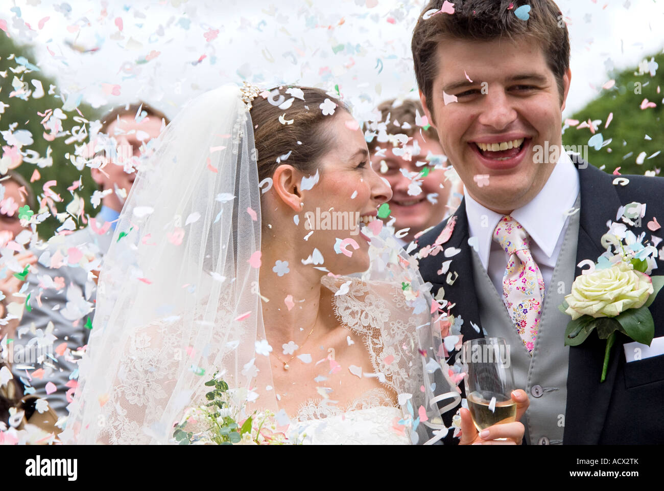 bride and groom with confetti Stock Photo - Alamy