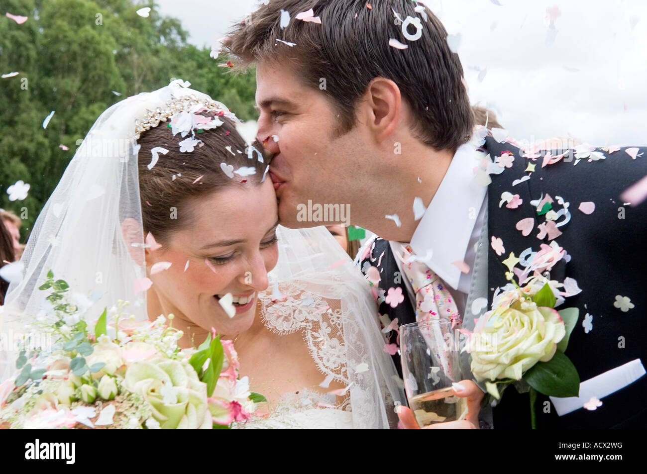bride and groom with confetti Stock Photo - Alamy