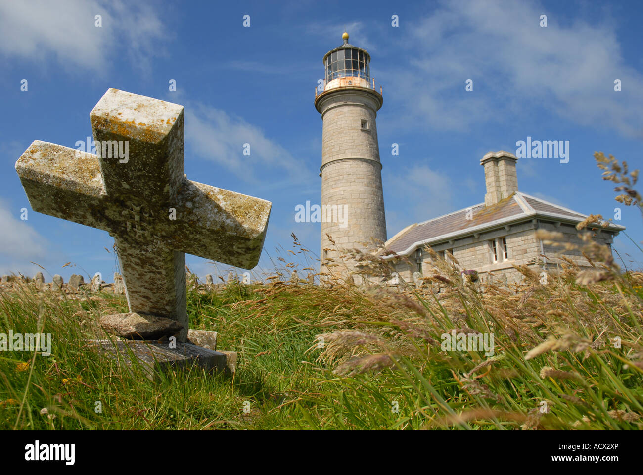 Gravestone and the old lighthouse on Lundy Island, England Stock Photo ...