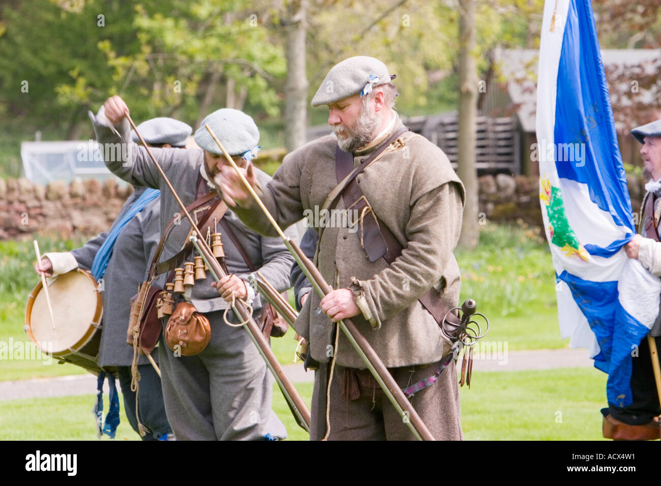 Covenanter soldier primes musket with rod Stock Photo - Alamy