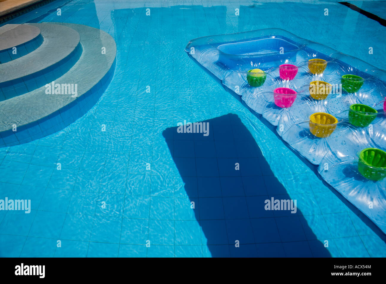 Swimming pool at a villa with a lilo floating in it Stock Photo - Alamy