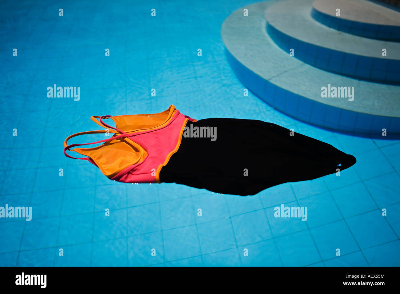 Swimsuit floating in a swimming pool at a villa Stock Photo - Alamy