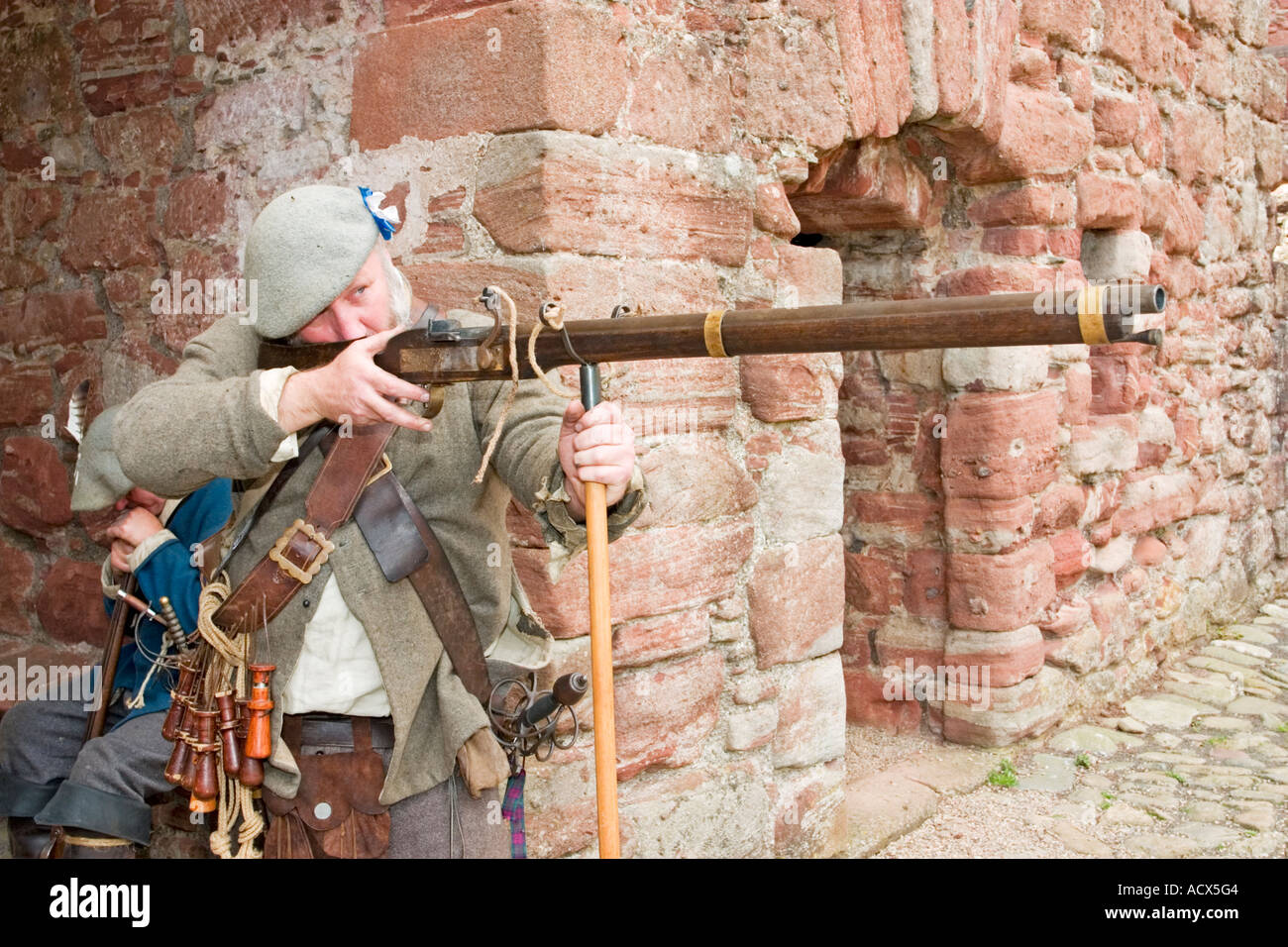 Covenanter soldier aiming traditional musket Stock Photo - Alamy