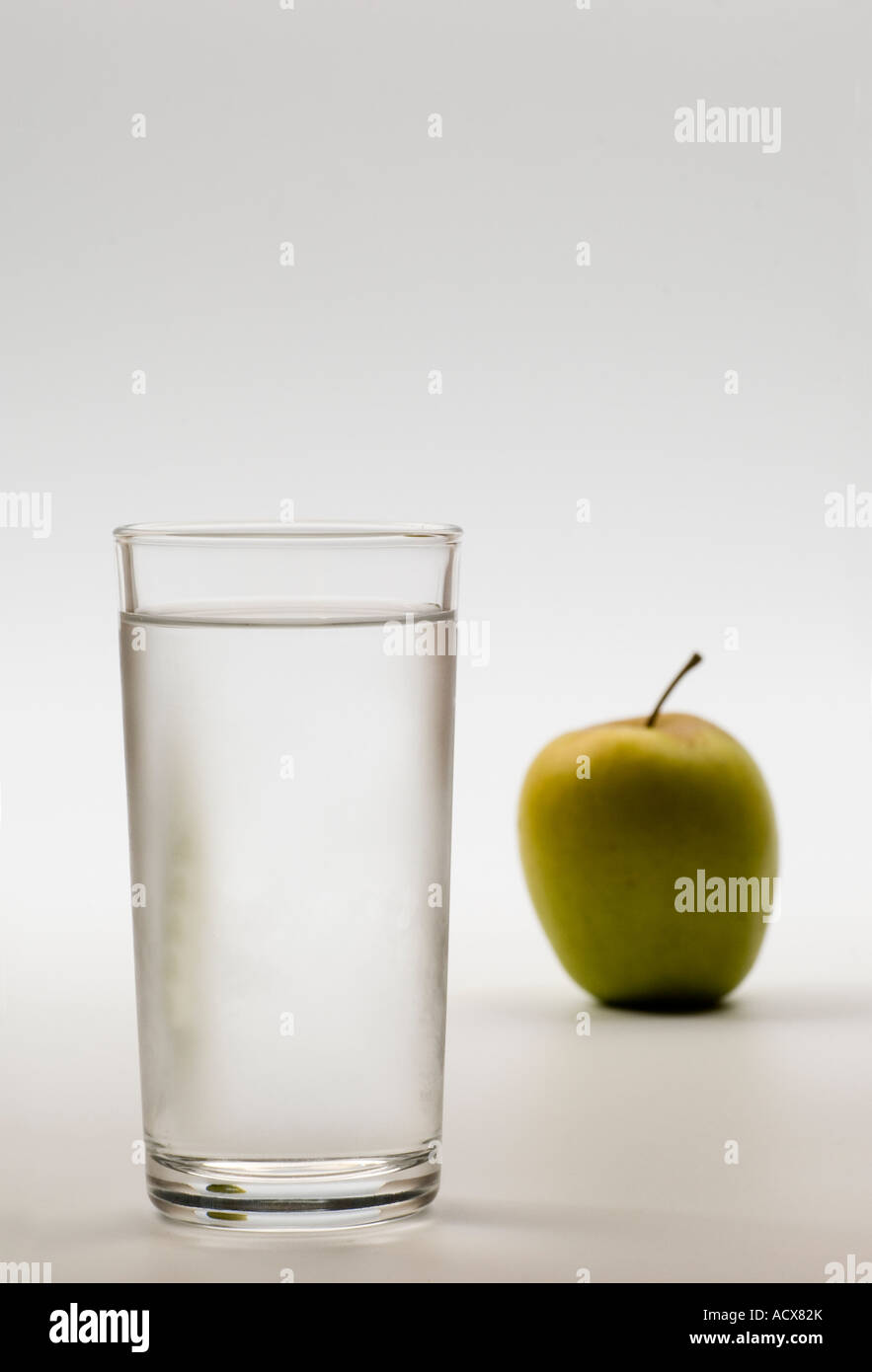 Glass of water and apple Stock Photo - Alamy