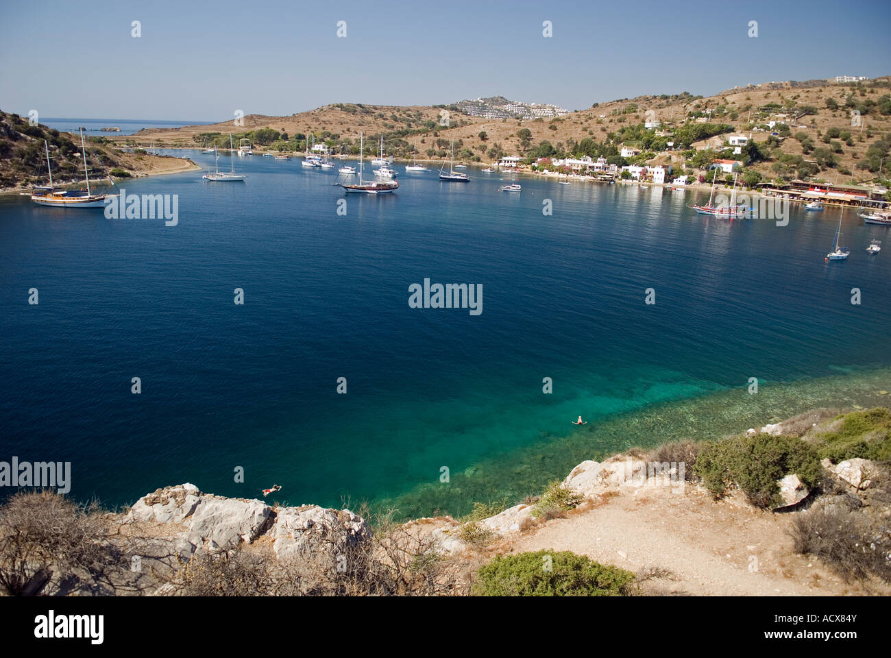Gumusluk, ancient Myndos Bay and crusing boats, Bodrum Turkey Stock ...