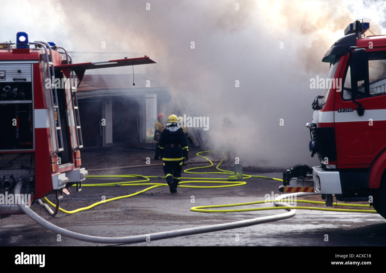 firemen tackling roof fire Stock Photo - Alamy