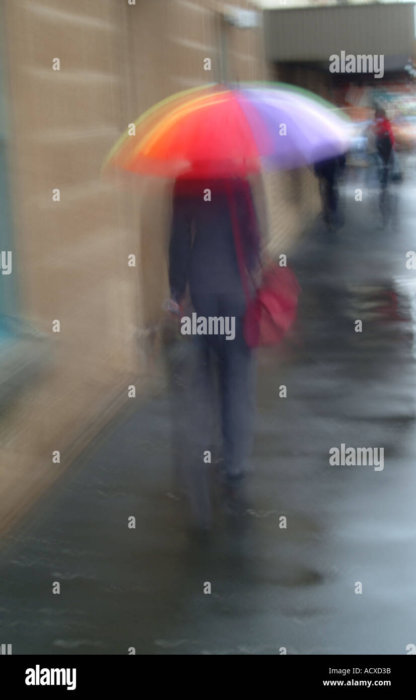 Man under umbrella in rain Stock Photo - Alamy