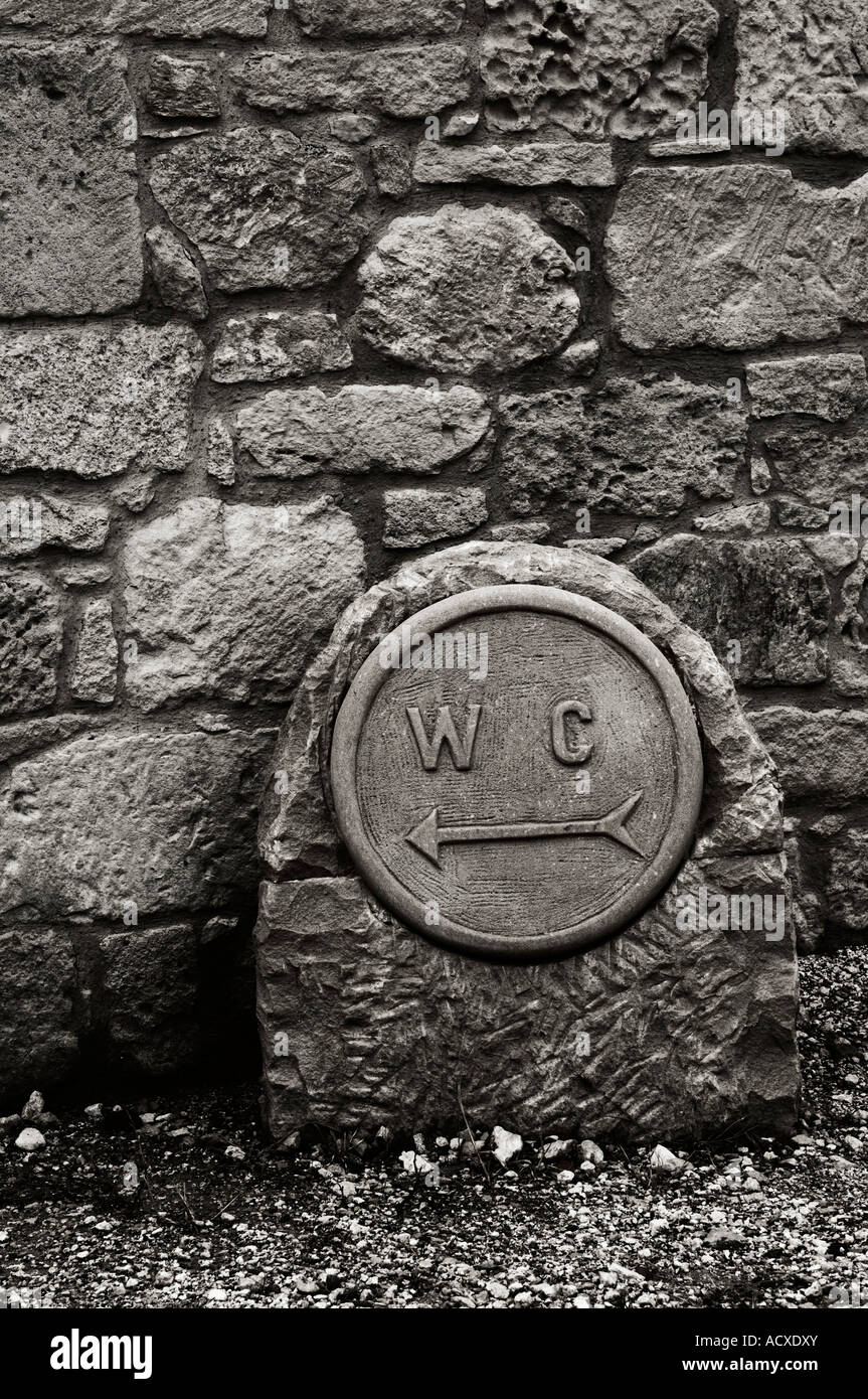 WC sign carved in stone Stock Photo - Alamy