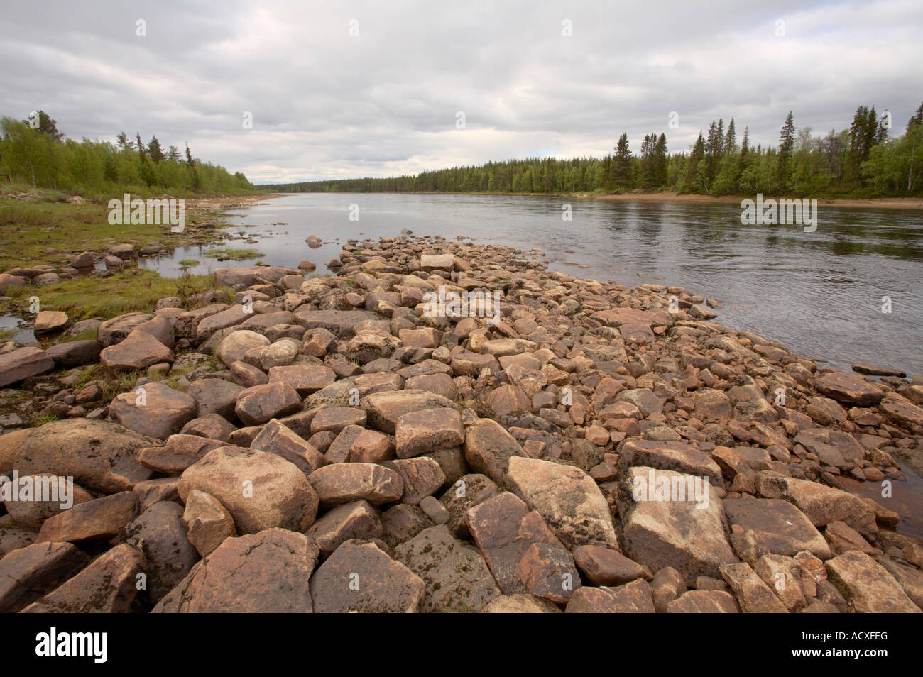 Rocky shore of Muonio river, border of Finland and Sweden, Lapland ...