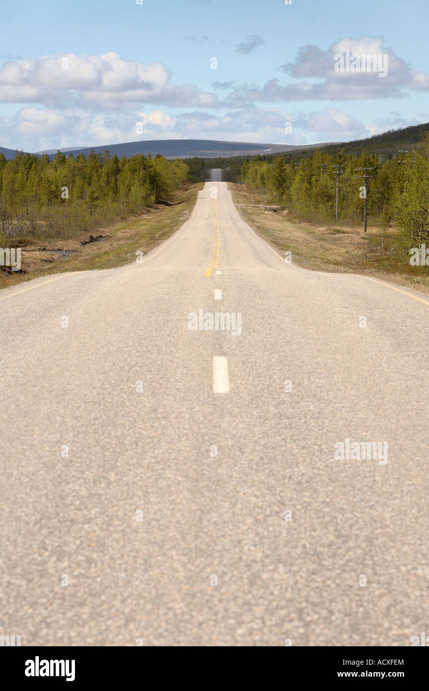 Undulating road amidst forest and hills, Enontekiö municipality ...