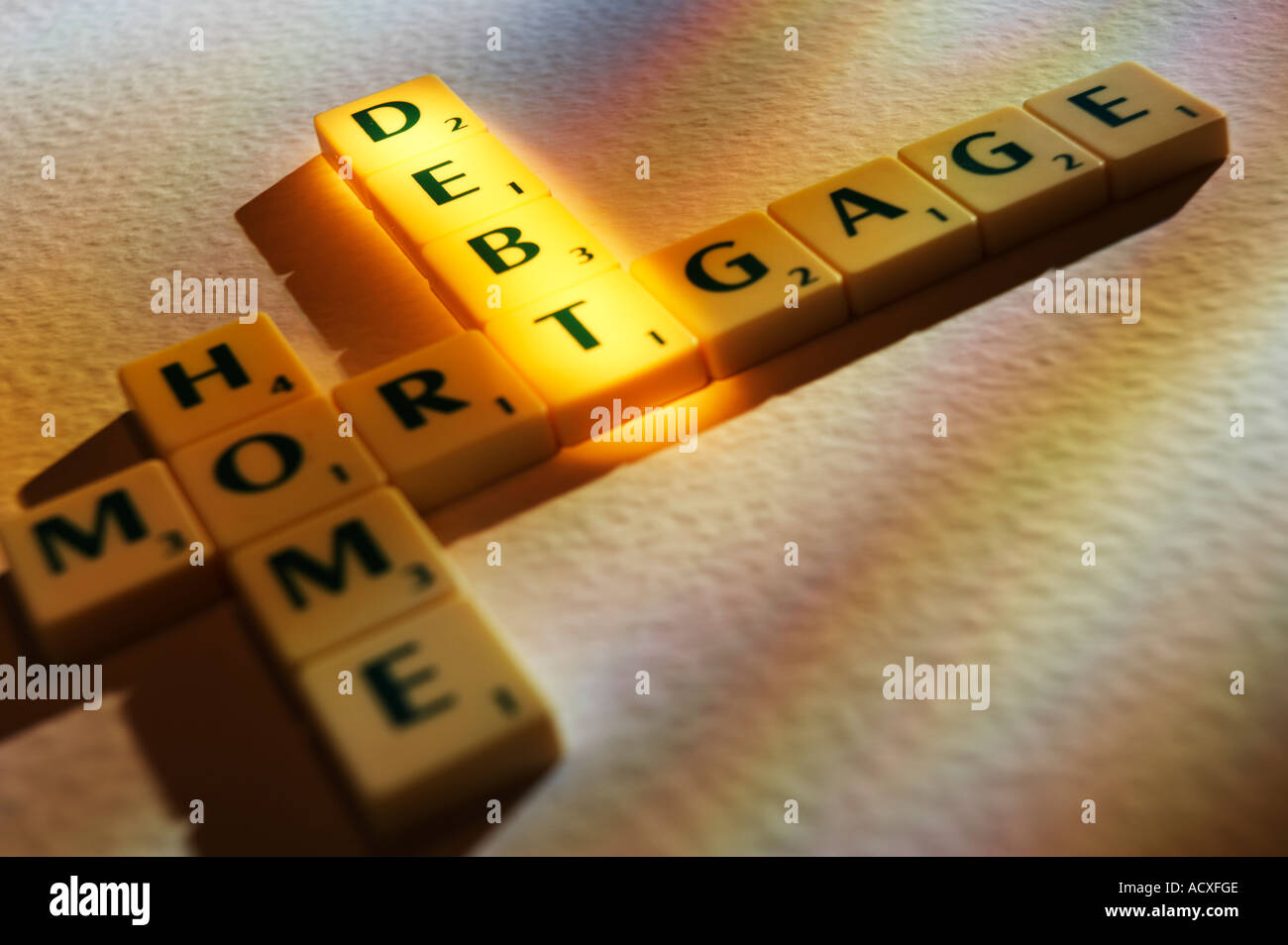 SCRABBLE BOARD GAME LETTERS SPELLING THE WORDS HOME MORTGAGE DEBT Stock ...