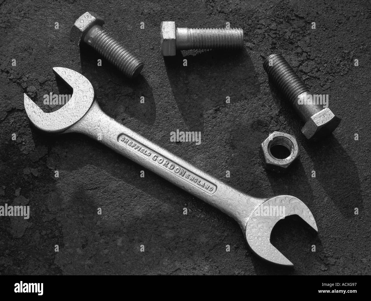Stainless steel spanner with new nuts and bolts in wet conditions Stock ...