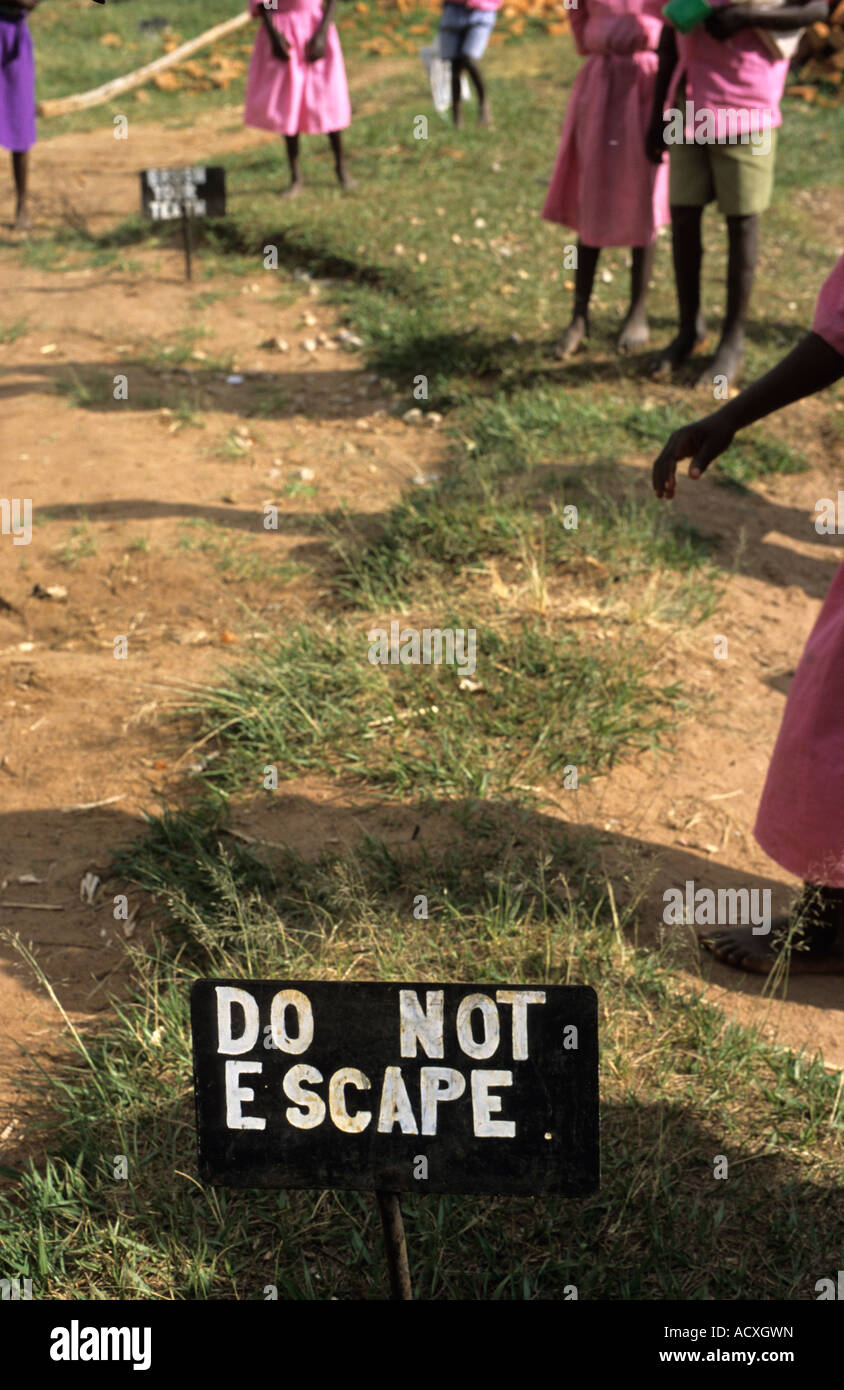 Uganda. Rural school .Sign in school field saying Do not escape Stock ...