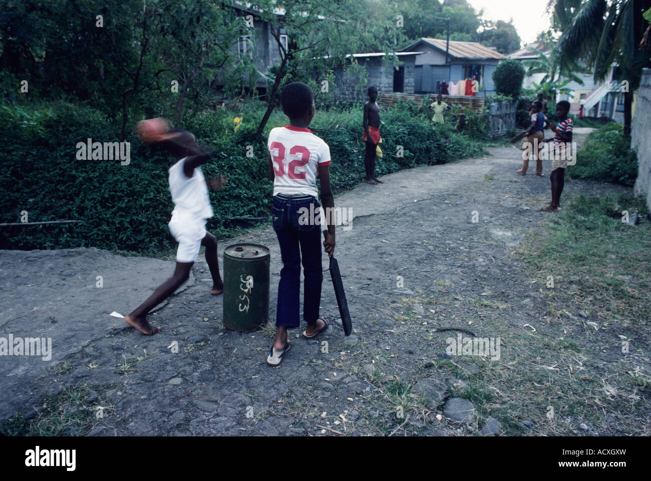 Grenada Children playing cricket Stock Photo - Alamy