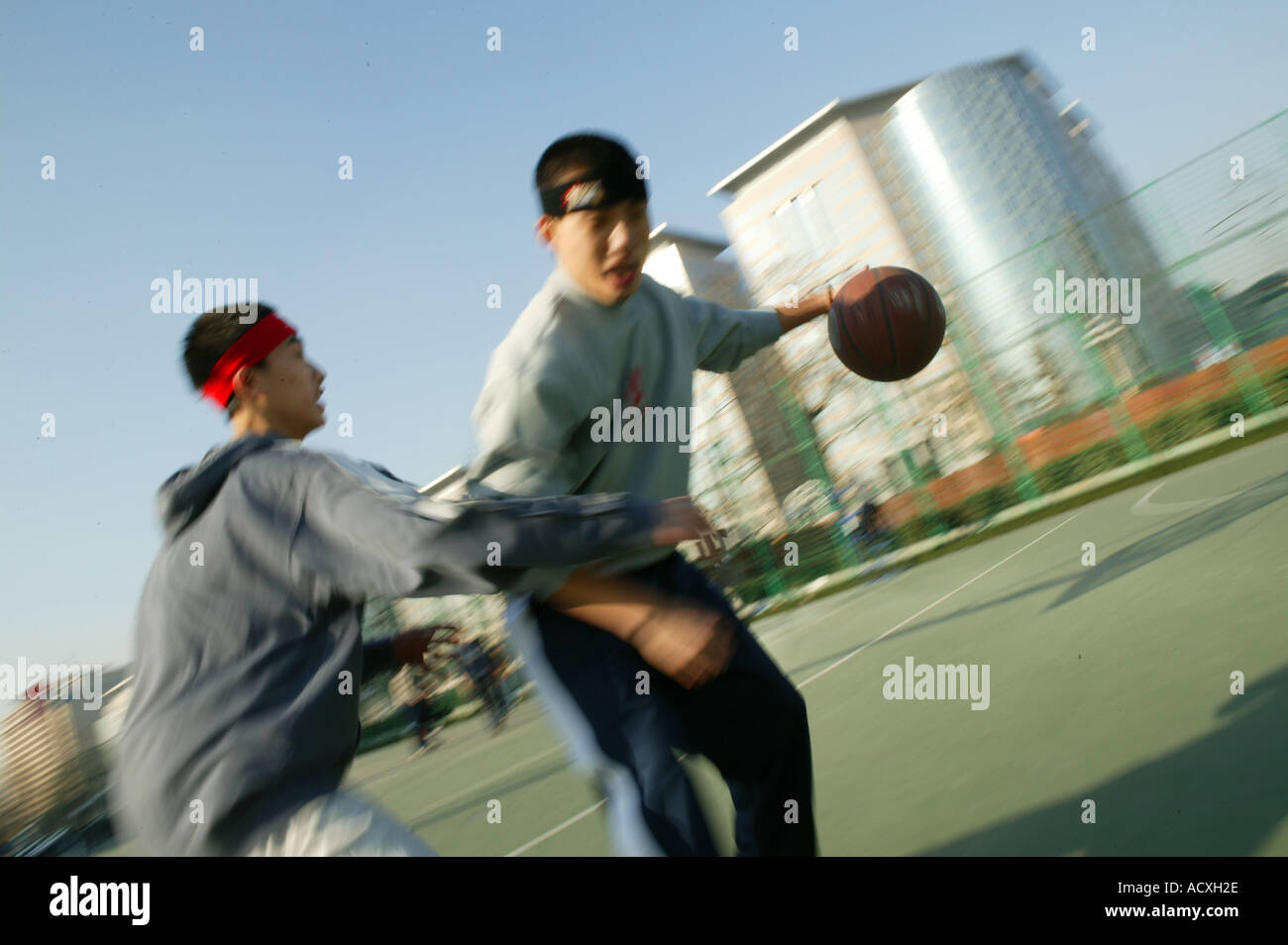 Chinese boys playing basketball Stock Photo - Alamy