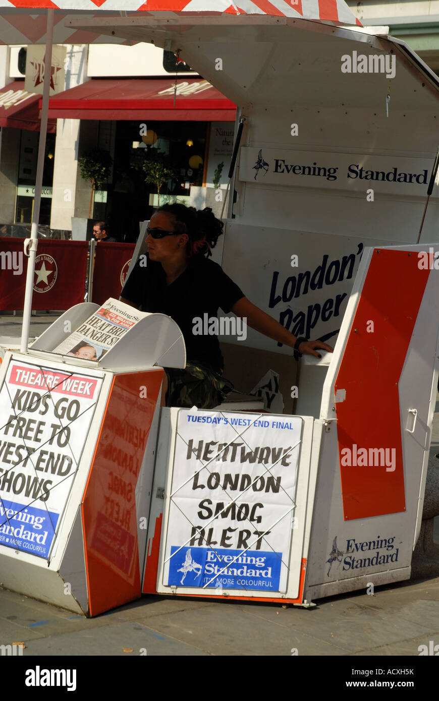 Woman selling newspapers hi-res stock photography and images - Alamy