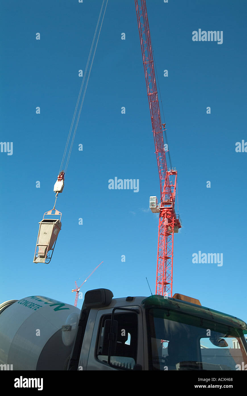 crane lifting cement mixer Stock Photo - Alamy