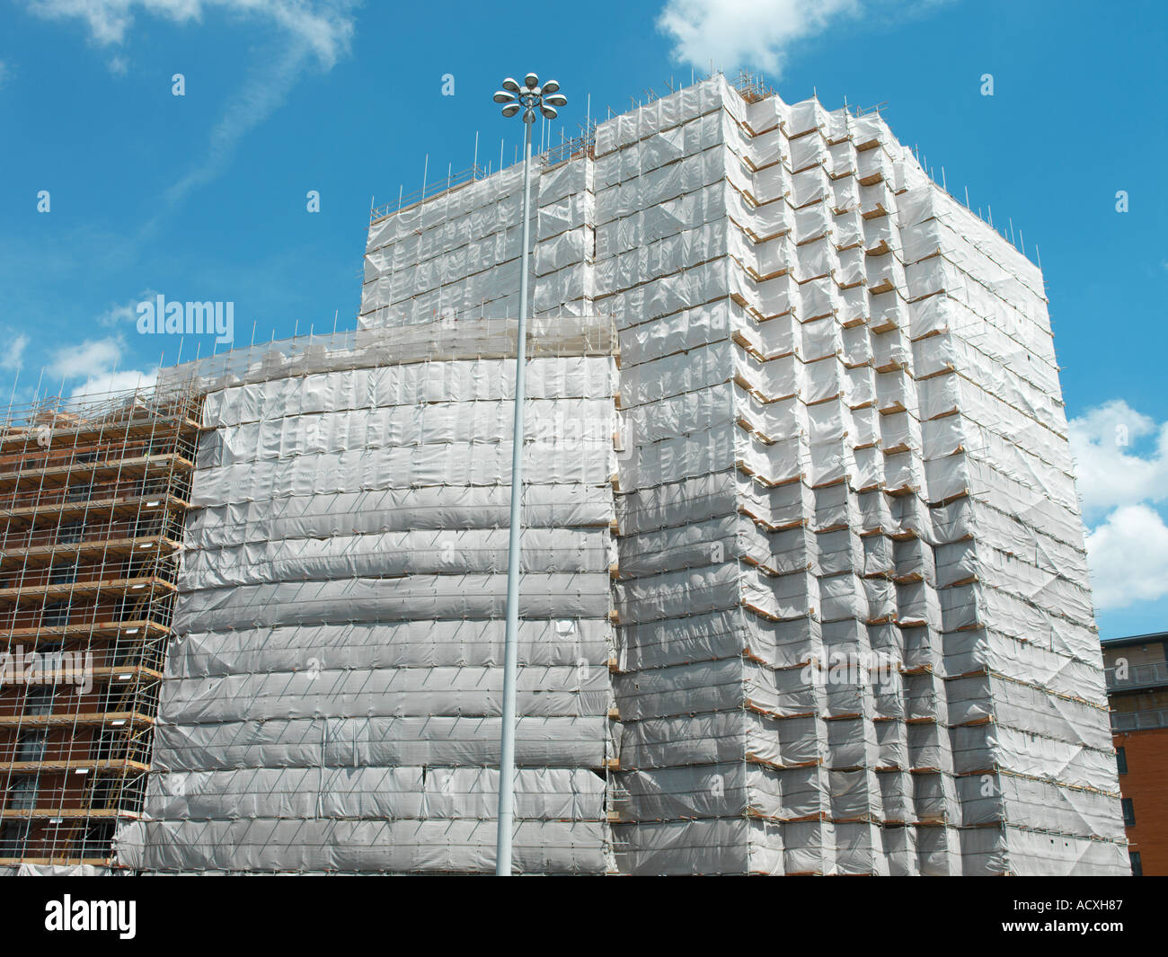 building wrapped in sheet Stock Photo - Alamy