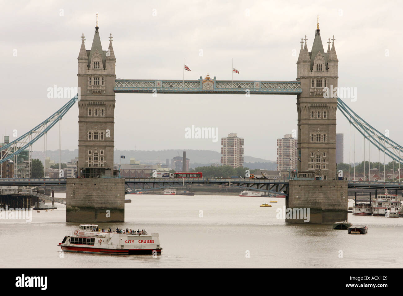 Gloomy English sky Tower Bridge London the Thames boat ship typical British rainy weather cloudy ...