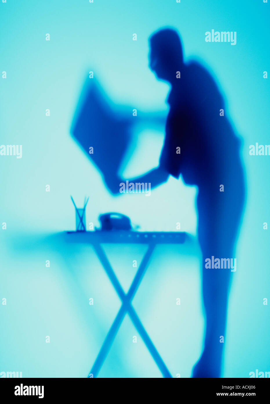 Man standing at desk Stock Photo - Alamy