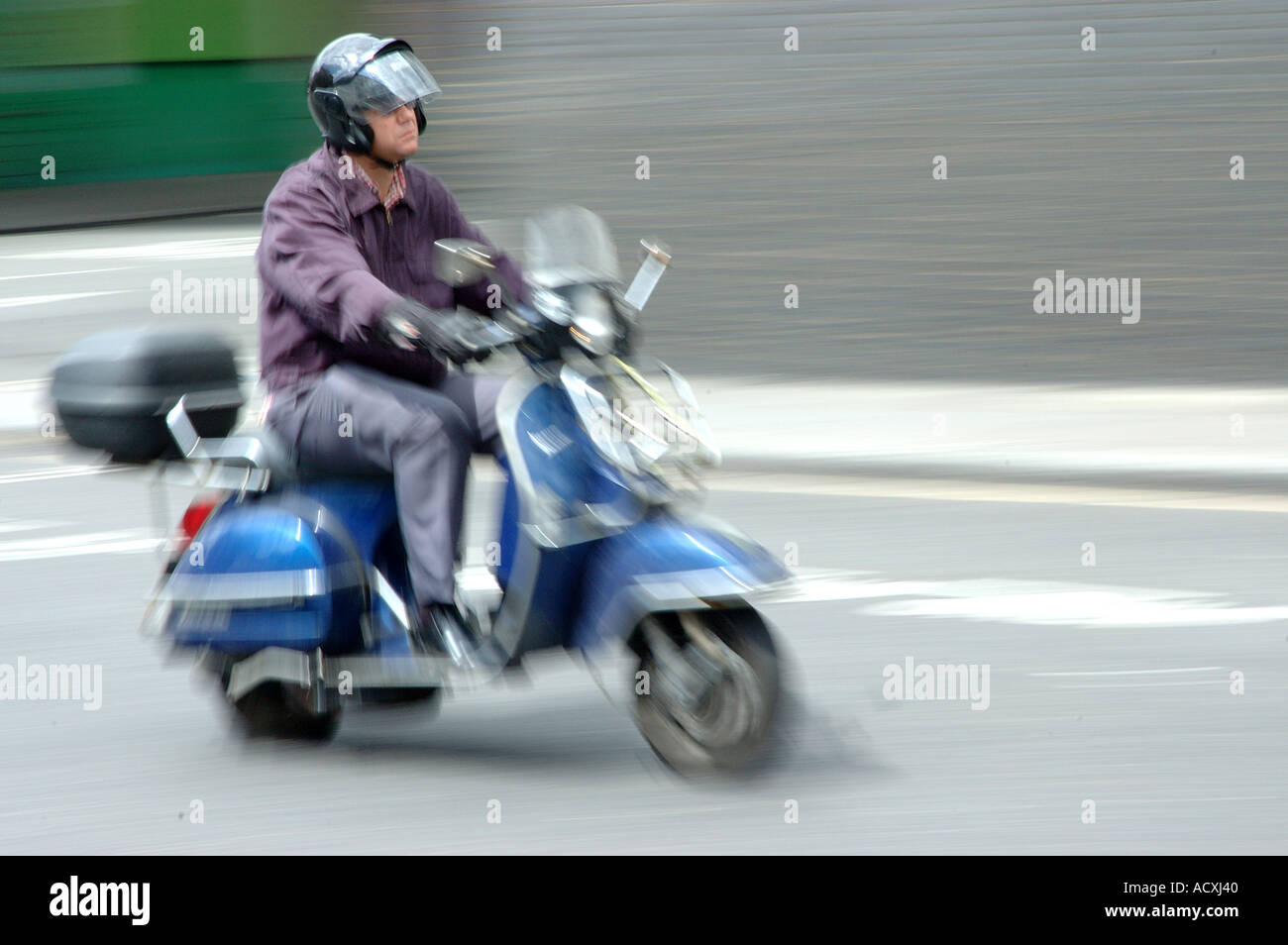 Man on Vespa PX riding through central of London Stock Photo - Alamy