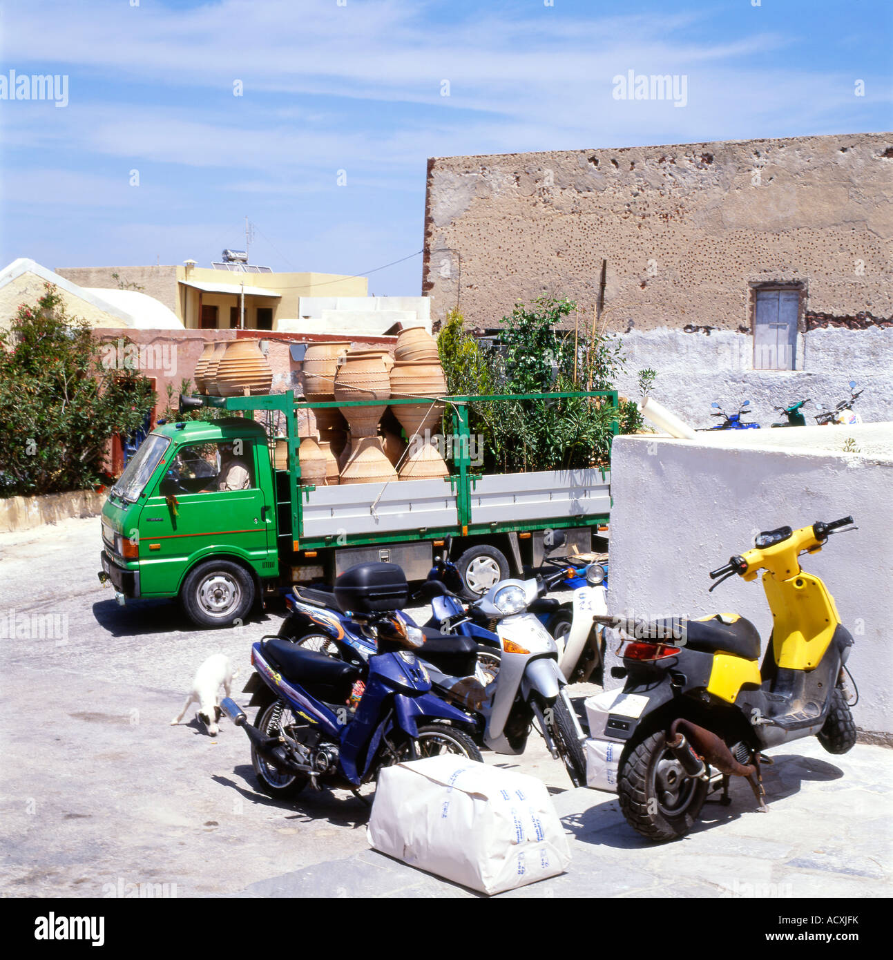 Olive trees and shrubs and terra cotta garden pots on delivery lorry ...
